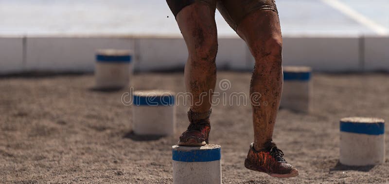 Mud race runners stock image. Image of track, handsome - 241425317