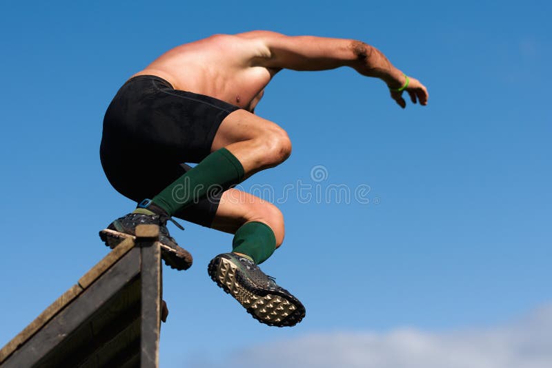 Mud Race Runners Running Over Obstacles Stock Image - Image of dirty ...