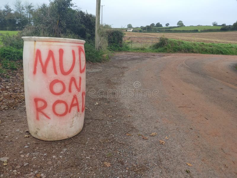 Mud on Road Warning Sign on Barrel Along Rural Road Stock Photo - Image ...
