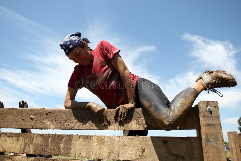 Man Competing in Obstacle Course and Mud Run Editorial Image - Image of ...