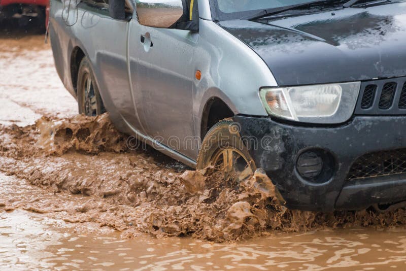 Mud Splash by a Car As it Goes through Flood Water Stock Photo - Image ...