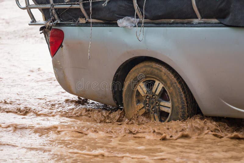 Mud Splash by a Car As it Goes through Flood Water Stock Photo - Image ...
