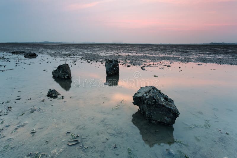 Mud stone stock image. Image of evening, dawn, drab, ocean - 25877999