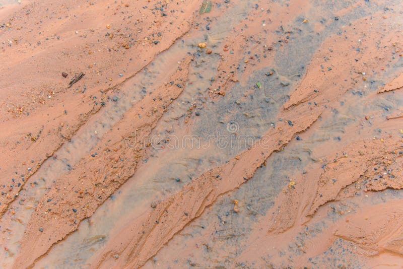 Mud and Stone in Water As it Flows Away on Road at Raining Day Stock ...