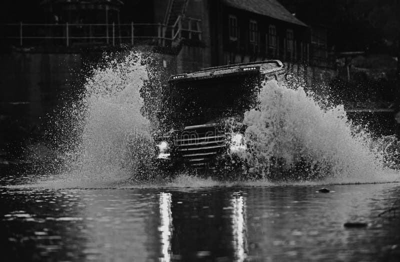 Mud And Water Splash In Off The Road Racing Jeep Crashed Into A Puddle And Picked Up A Spray Of
