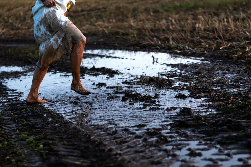 Muddy Bare Feet of a Running Woman Running Across Field Stock Image ...