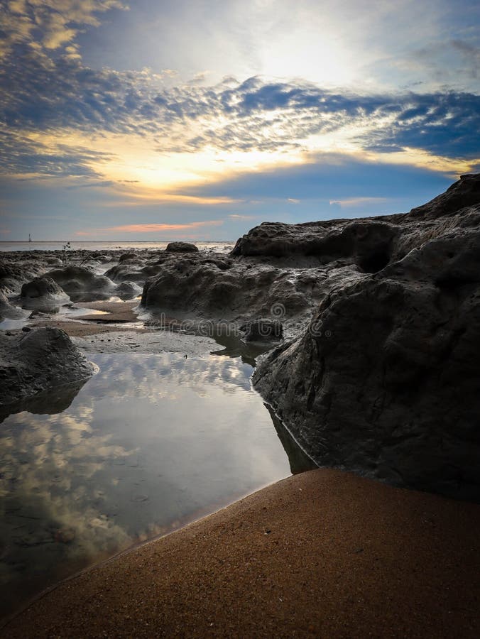 Muddy beach at sunset stock image. Image of malaysia - 292549443