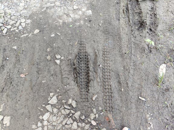 A Muddy Dirt Road with Ruts Stock Image - Image of soil, ruts: 392513773