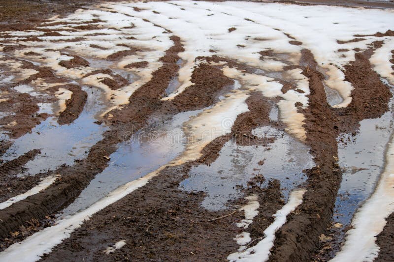 A muddy driveway in Spring stock photo. Image of driveway - 370890866