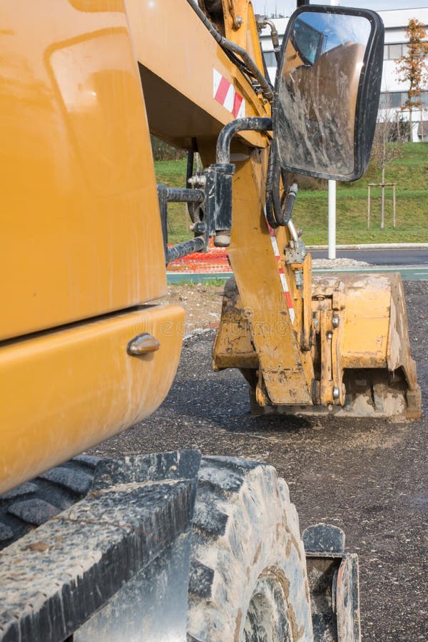Muddy Excavator Shovel with Rear-view Mirror at Construction are Stock ...
