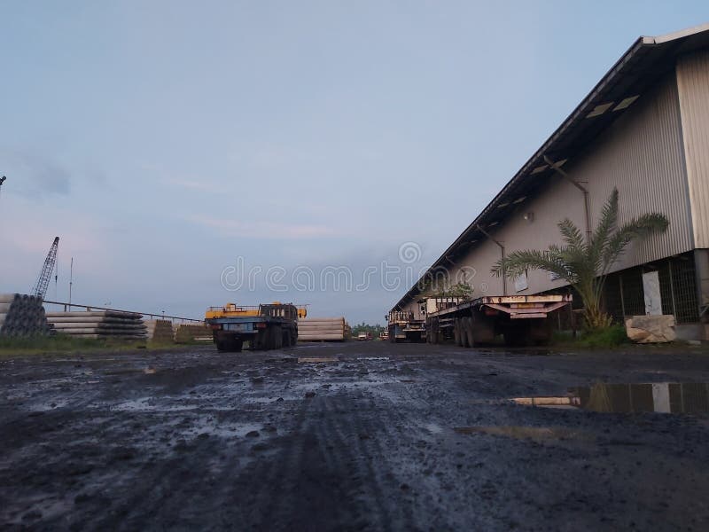 Muddy Ground in a Factory that Reflects Things, in a Factory that Makes ...