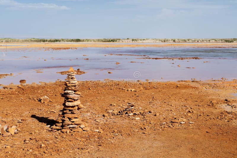 Muddy Ground with Spring Water, with Stacks of Stones on One Side Stock ...