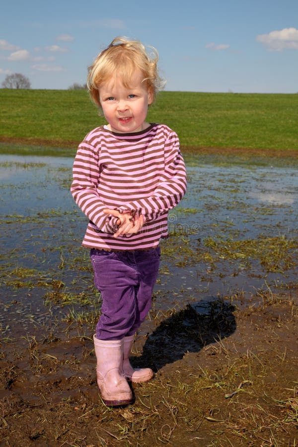 Muddy stock photo. Image of jacket, cheerful, earth, puddle - 30572512