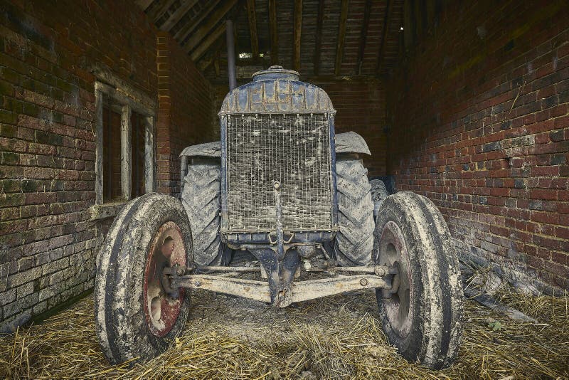 A Muddy Old Rustic Tractor in a Barn Stock Image - Image of country ...
