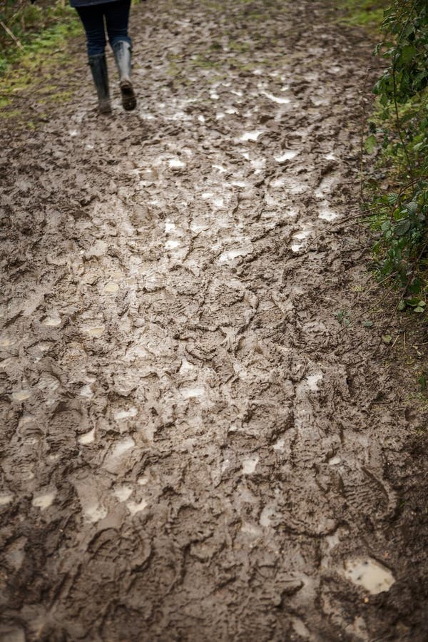 Muddy path stock photo. Image of boots, feet, muddy, person - 36586422