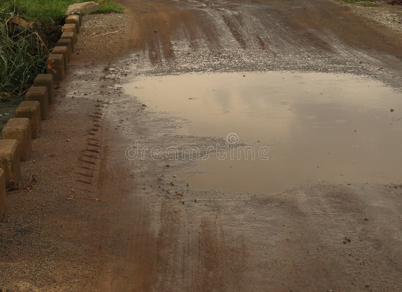 A Muddy Puddle on a Dirt Road Stock Image - Image of sand, adventure ...