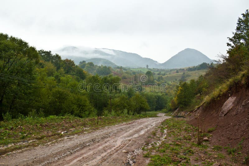 Muddy rural road stock image. Image of tourist, ordinary - 20969775