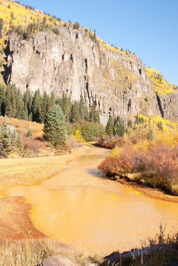 Muddy Yellow River in Colorado Stock Photo - Image of mountain, foliage ...