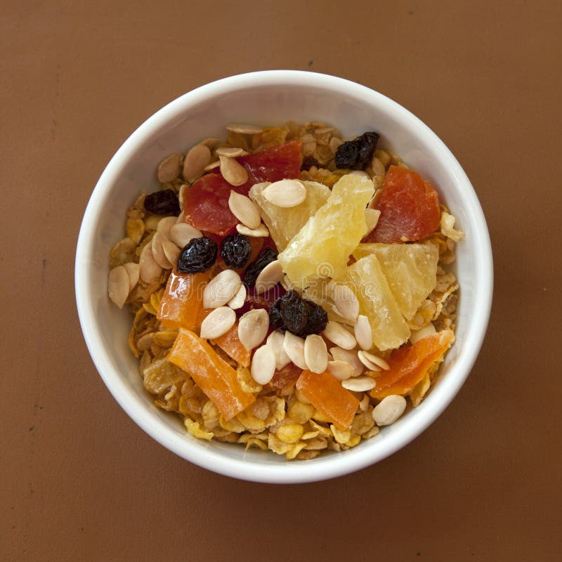 Cereal Muesli (granola) In A Bowl With Berries And Dried Fruit And Milk ...