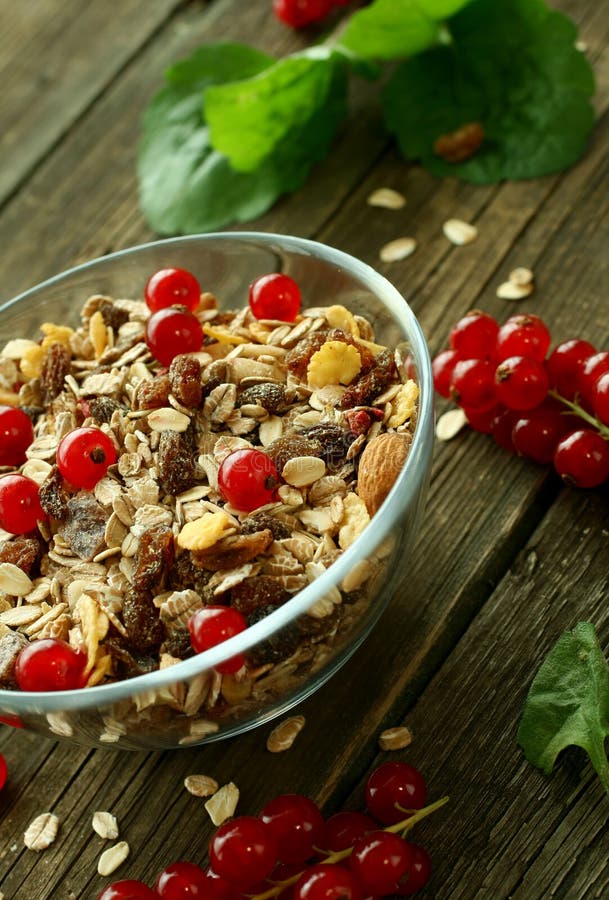 Muesli in Glass Bowl and Red Currant on Wooden Stock Image - Image of ...