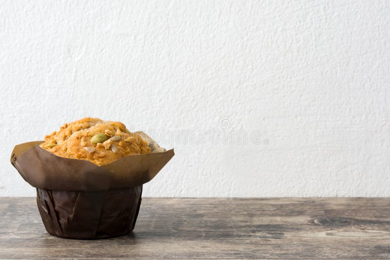 Muffin with Nuts on a Rustic Wooden Table and White Wall Stock Photo ...