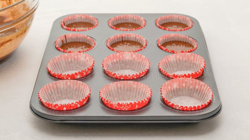 Muffin Pan with Paper Cupcake Liners Close Up on Kitchen Table. Step by ...