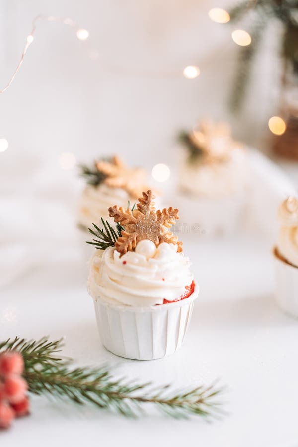 Muffins with Snowflake Cookies in Front of Christmas Decorations Stock ...