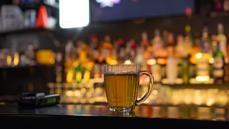 A Mug of Beer on the Bar Counter in a Pub. Stock Photo - Image of ...