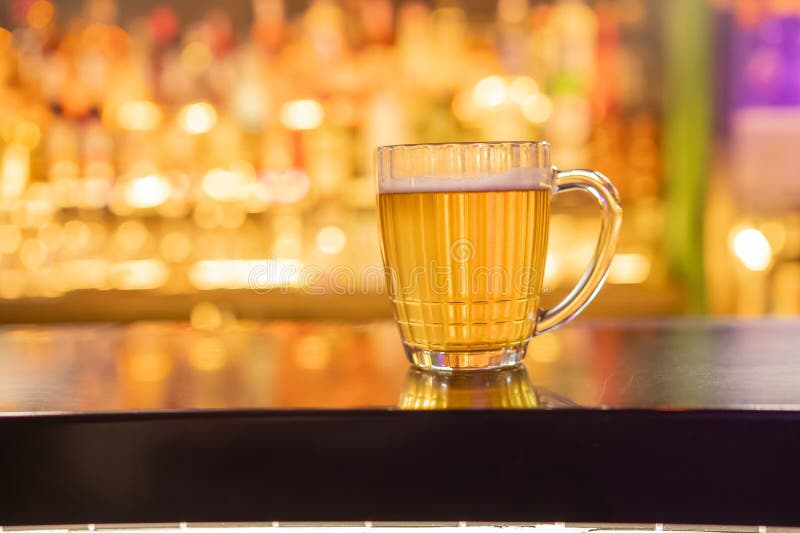 A Mug of Beer on the Bar Counter in a Pub. Stock Photo - Image of ...