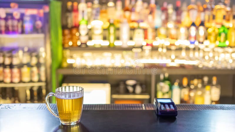 A Mug of Beer on the Bar Counter in a Pub. Stock Image - Image of gold ...