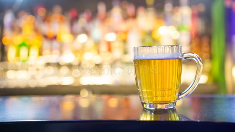 A Mug of Beer on the Bar Counter in a Pub. Stock Photo - Image of beer ...