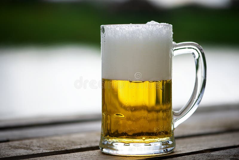 Mug of Beer on Dark Wooden Table Outdoor Stock Photo - Image of full ...