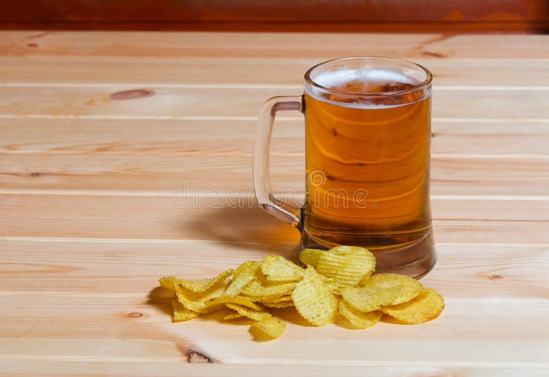 Mug of Beer and Potato Chips on Table Stock Image - Image of freshness ...