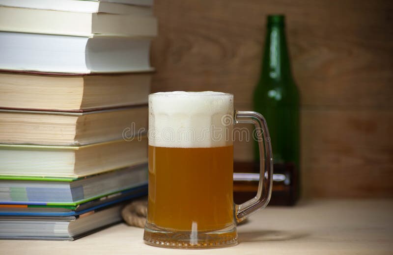 A Mug of Beer with a Stack of Books Stock Image - Image of books, beer ...
