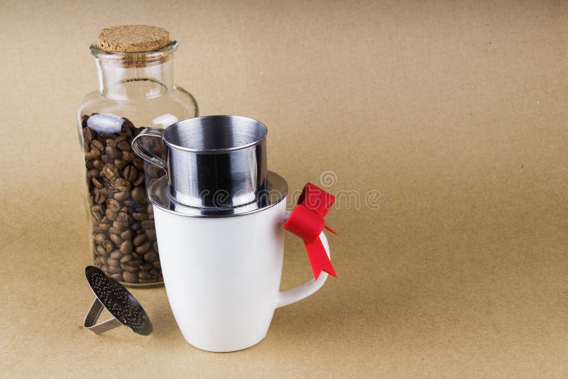 Mug with Coffee Dripper, and a Glass Jar of Coffee Beans. Stock Photo ...
