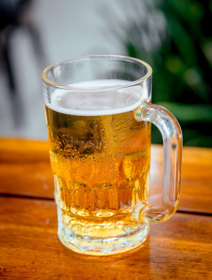 Mug of cold beer stock image. Image of people, cultures - 65081641