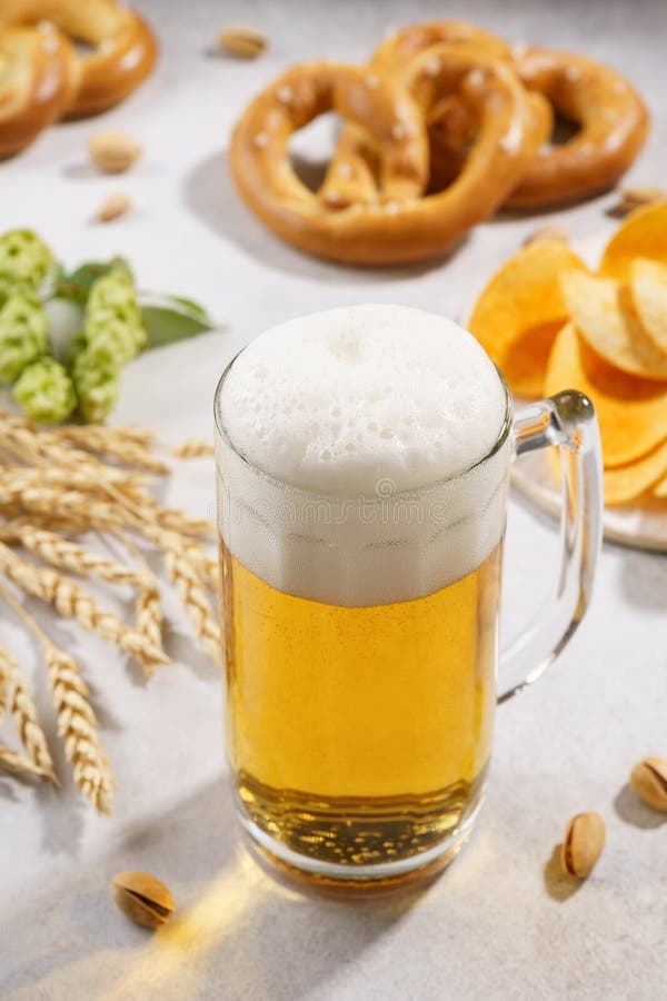 A Mug of Draft Beer and Various Snacks Around Stock Photo - Image of ...