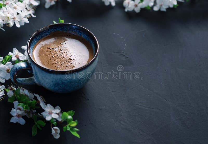 A Mug of Fragrant Coffee on the Table with Spring Blooming Flowers Copy ...