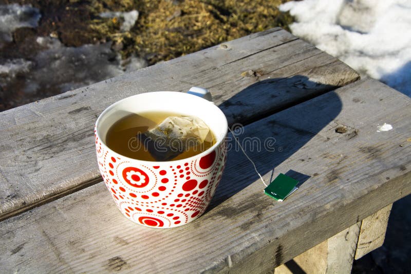 A mug of tea on the bench. stock photo. Image of chopped - 215425278