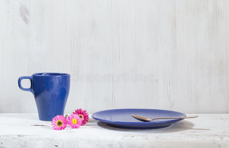 Mug and plates on table stock image. Image of retro - 173816983