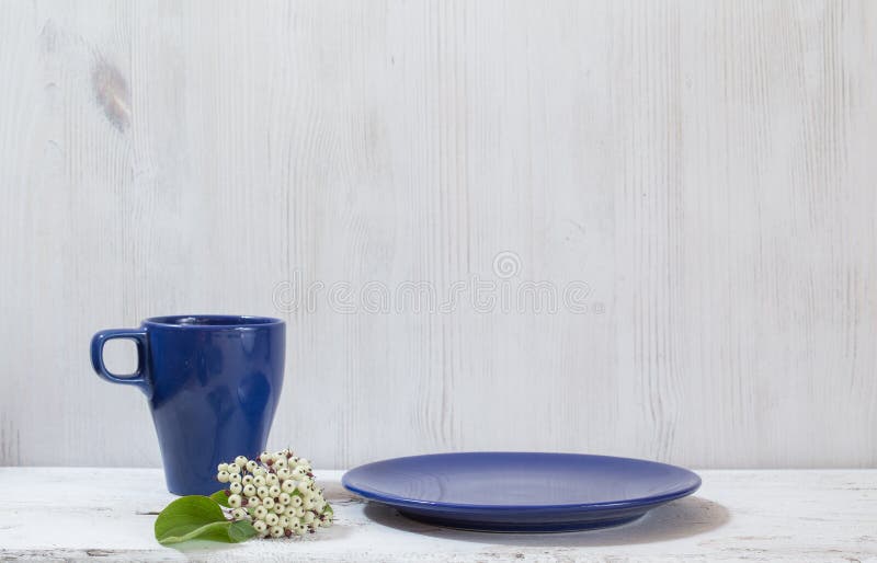 Mug and plates on table stock image. Image of retro, wooden - 62887071