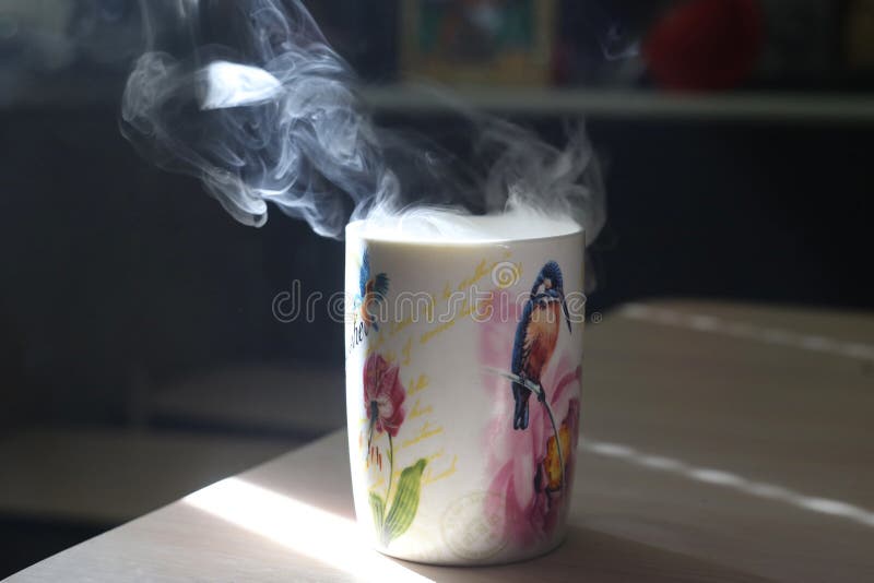 Mug with smoke on a table stock image. Image of closeup - 114470459