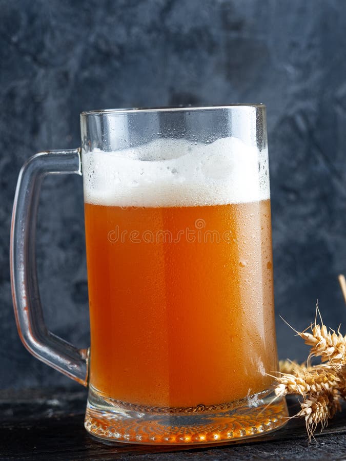 Mug of Wheat Unfiltered Beer Close-up with Ears of Wheat Stock Photo ...