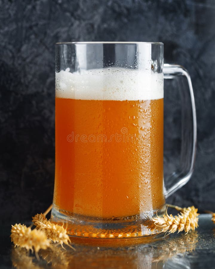 Mug of Wheat Unfiltered Beer Close-up with Ears of Wheat Stock Photo ...