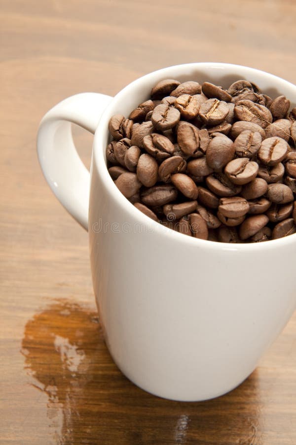 Mugg of coffee beans stock image. Image of wood, roasted - 10499645