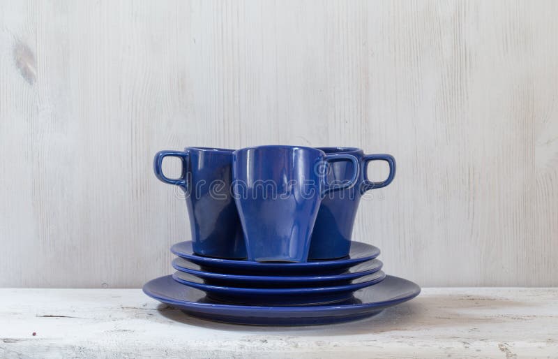 Mugs and plates on table stock image. Image of retro - 62887041