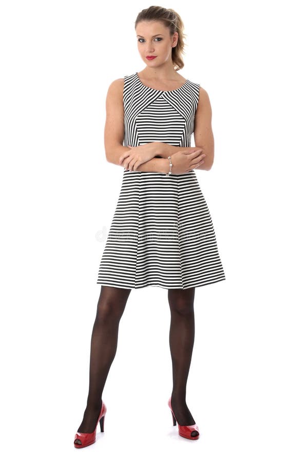 Mujer Que Modela a Mini Dress with Arms Folded Corto Foto de archivo ...