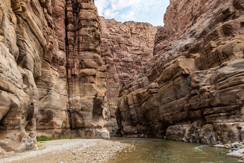 The Mujib River Flows at the Start of the Mujib River Canyon Hiking ...