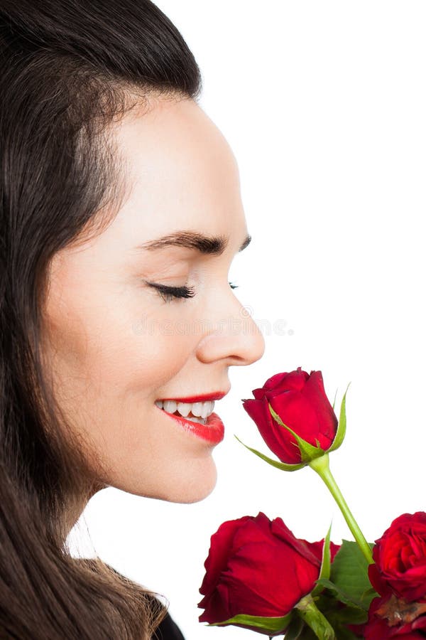 Mulher que cheira uma rosa foto de stock. Imagem de retrato - 37457848