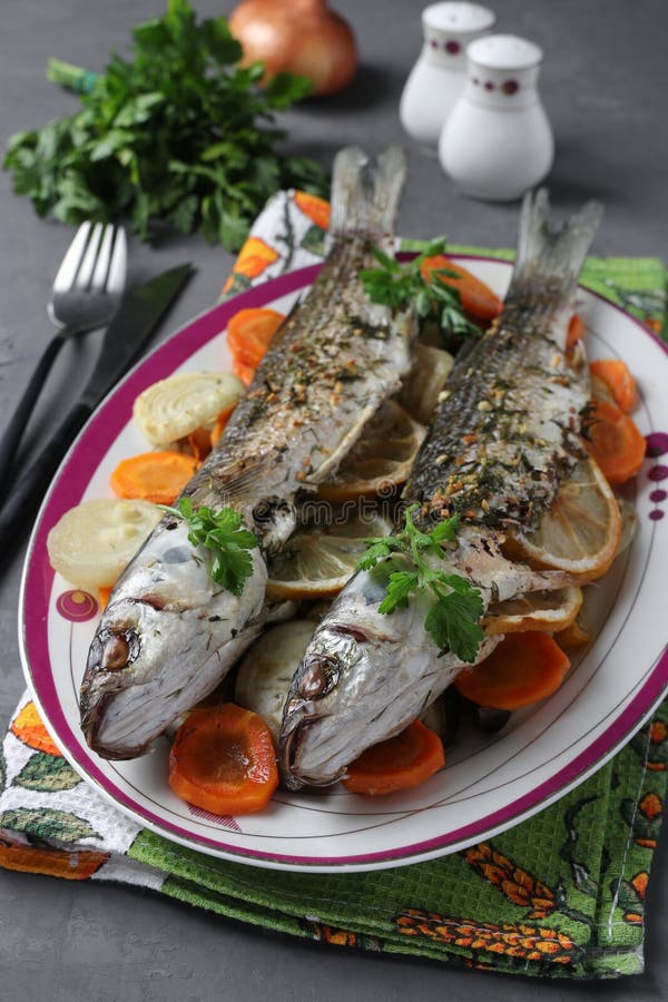 Mullet Baked with Vegetables, Spices and Lemon Served on a Plate, Stock ...